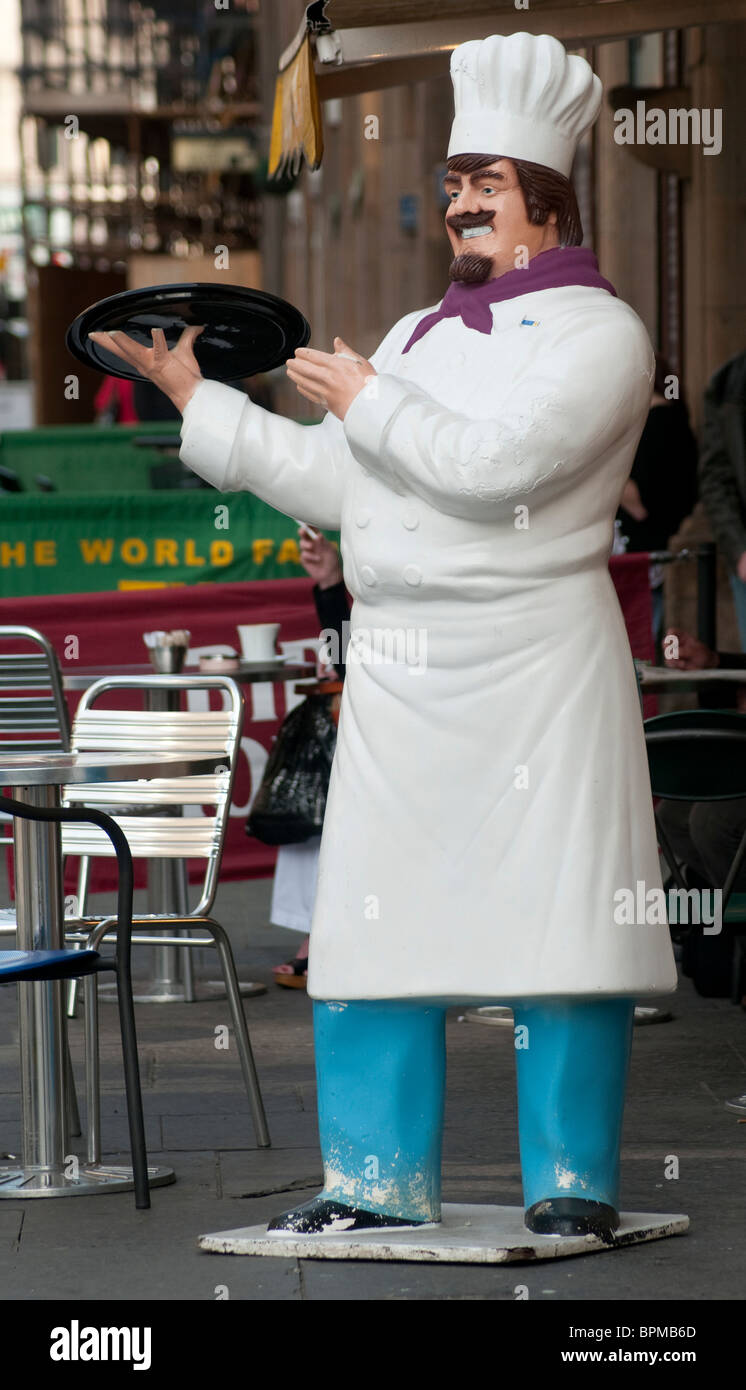 A large model of a pizza chef stands outside a city centre restaurant ...
