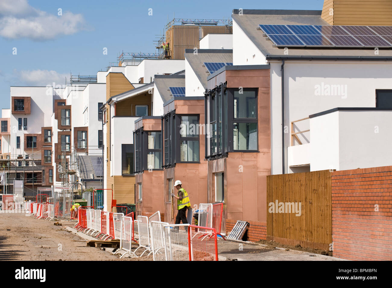 Modern apartments with solar panels on roof and copper cladding around ...