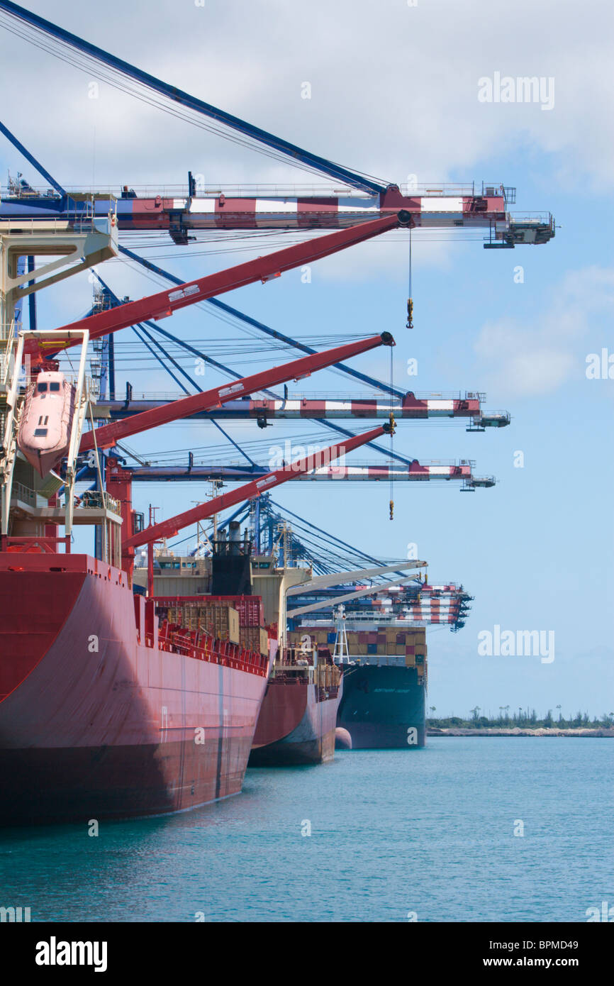 Container ships load cargo at Freeport container terminal, Bahamas ...