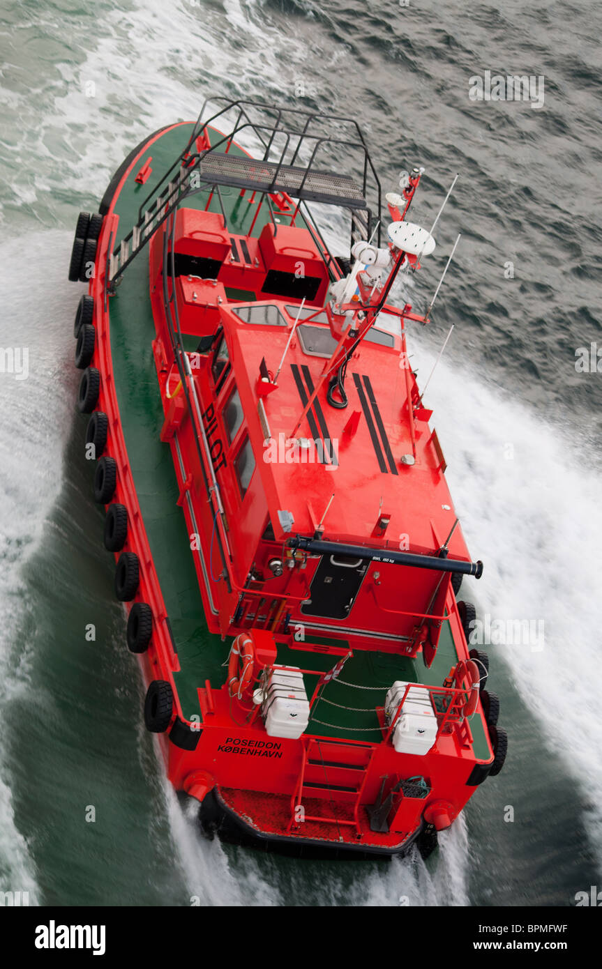 A pilot boat helps to safely guide the P&O cruise ship 'Aurora' out of ...