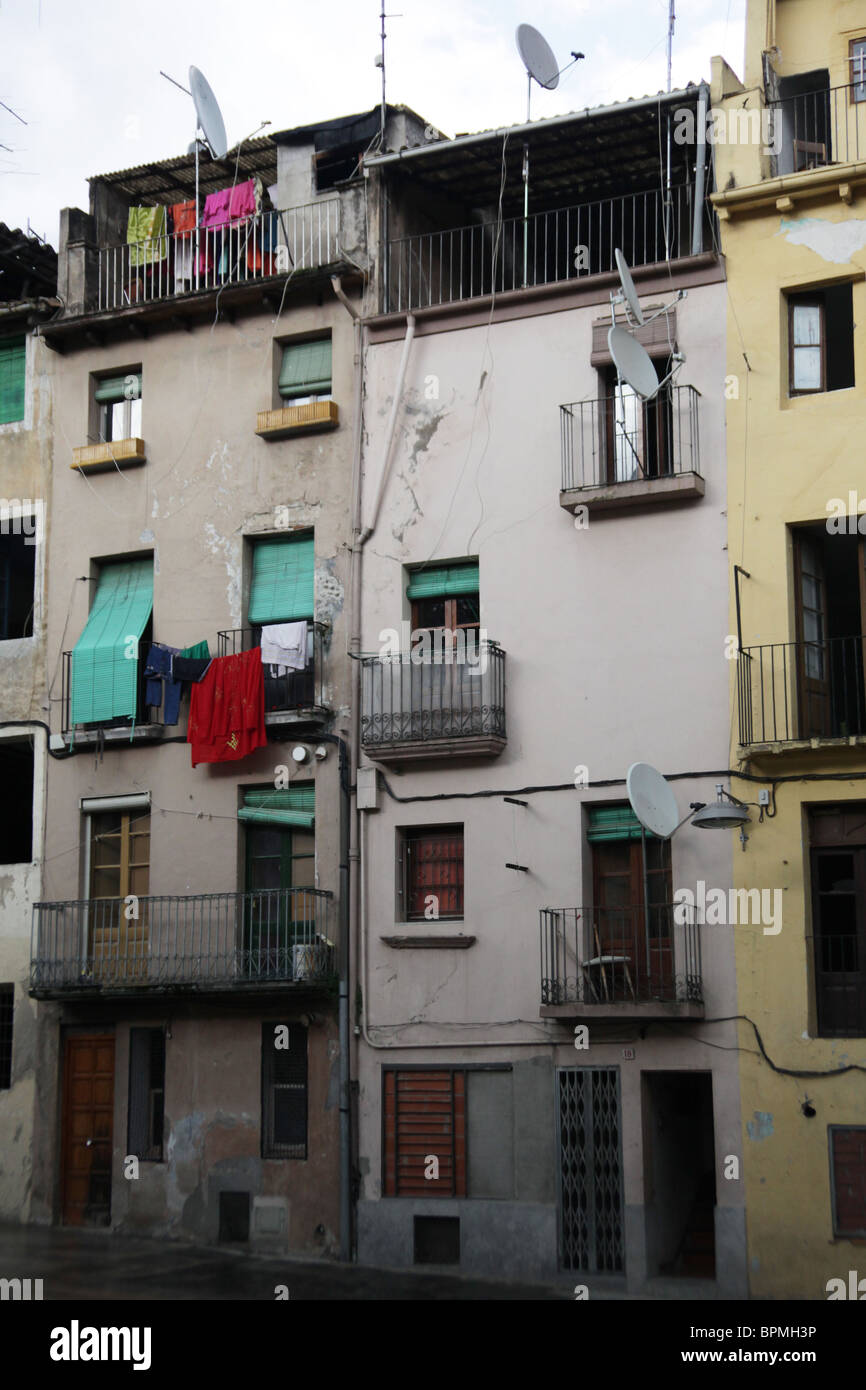 A block of poor houses and flats street scene from Olot in the La ...