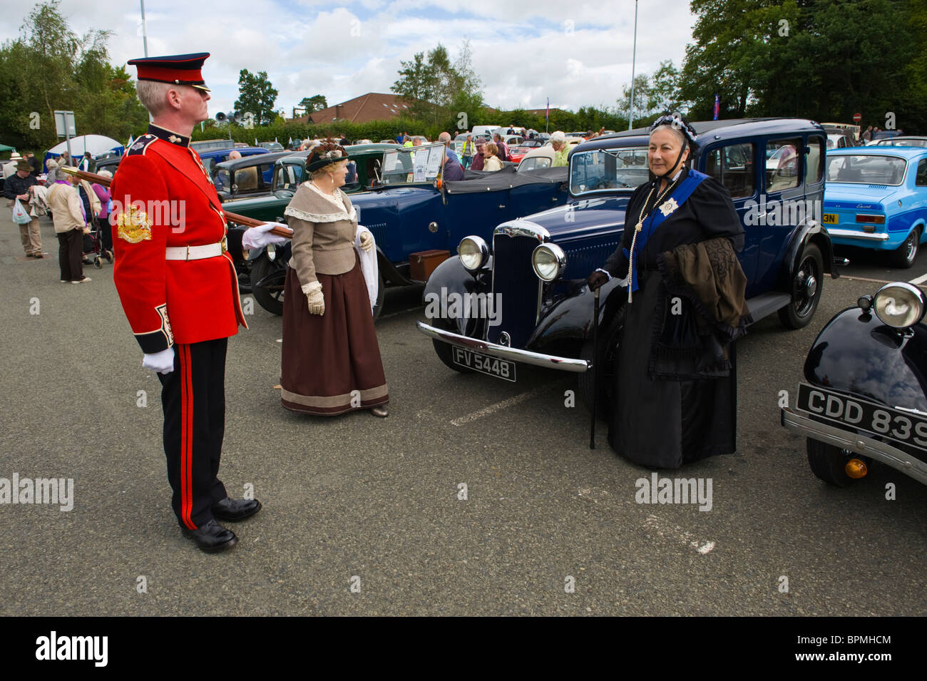 Queen Victoria looking at restored classic motor cars on show during ...