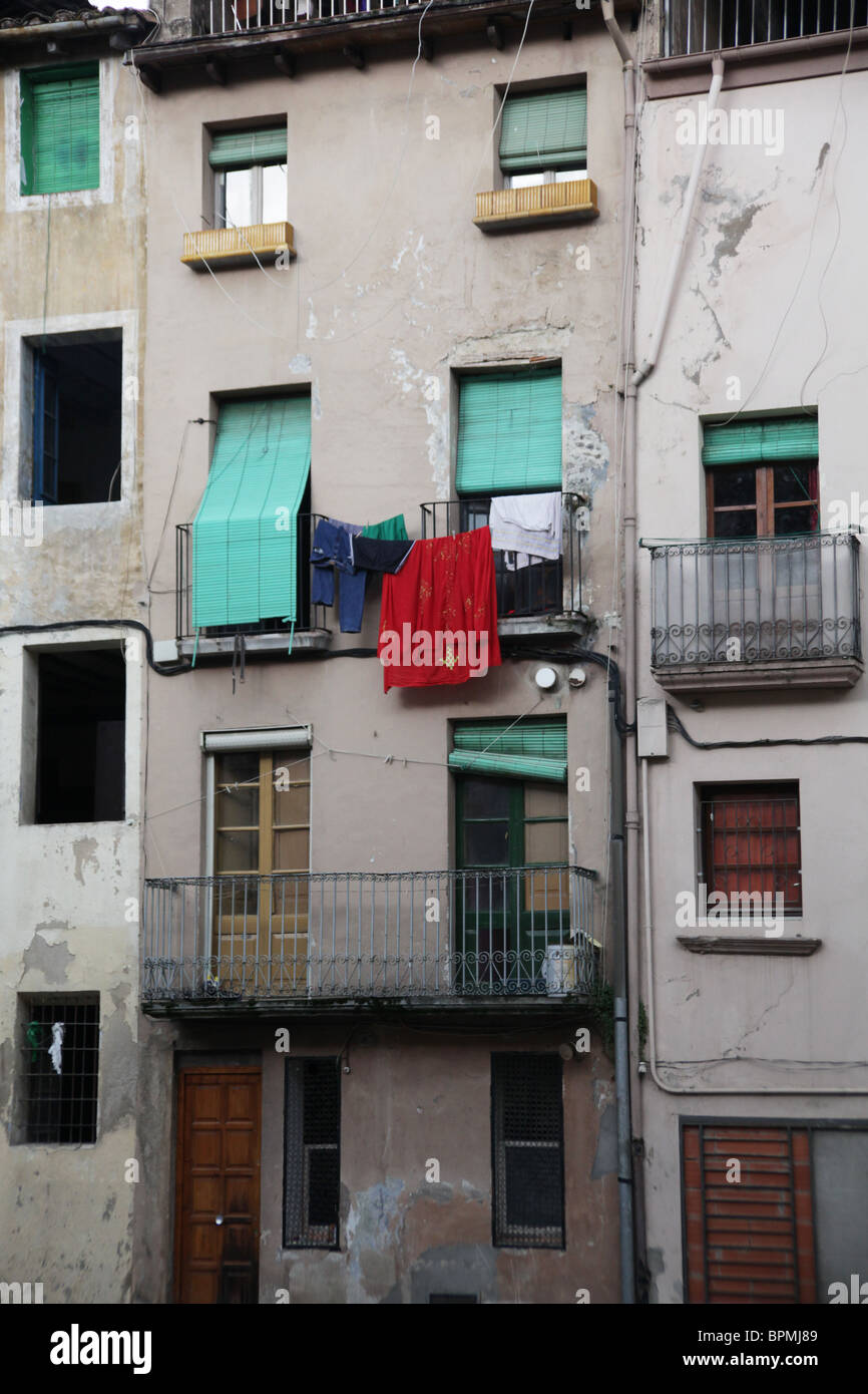 A block of poor houses and flats street scene from Olot in the La ...