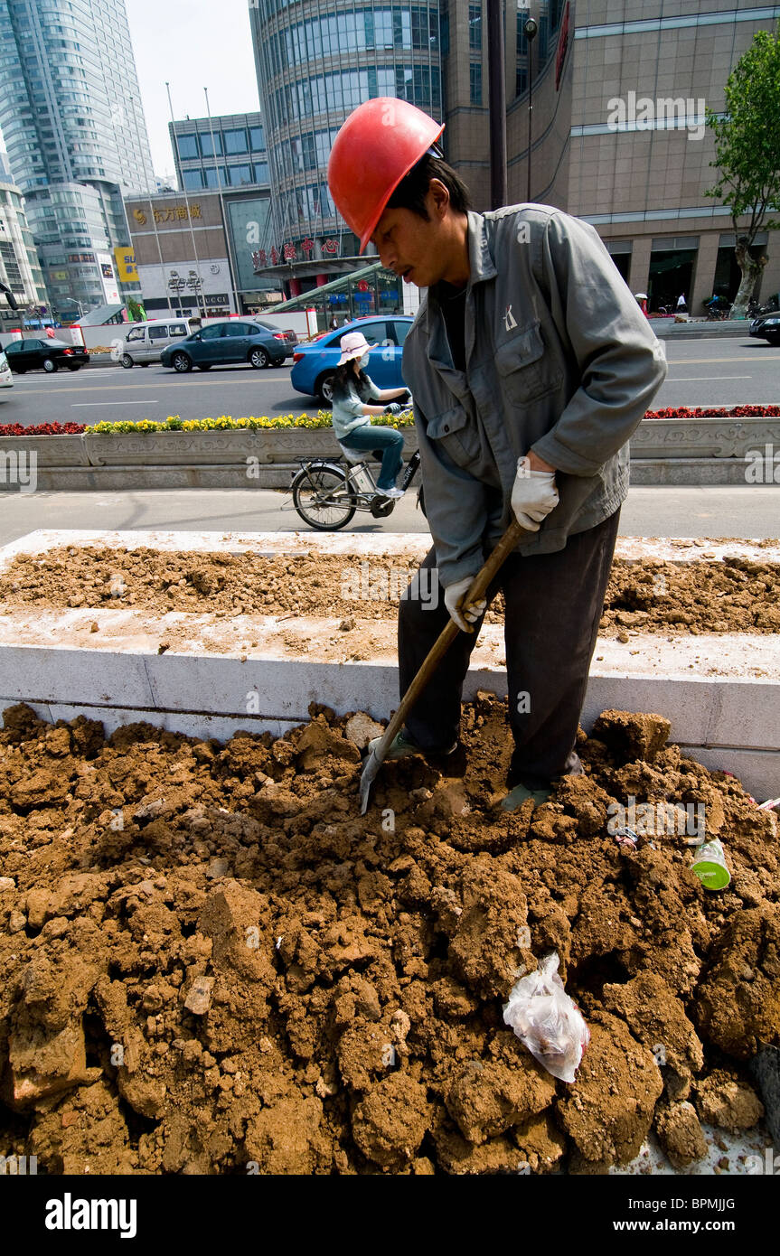 Chinese construction workers are busy building a new modern China Stock ...