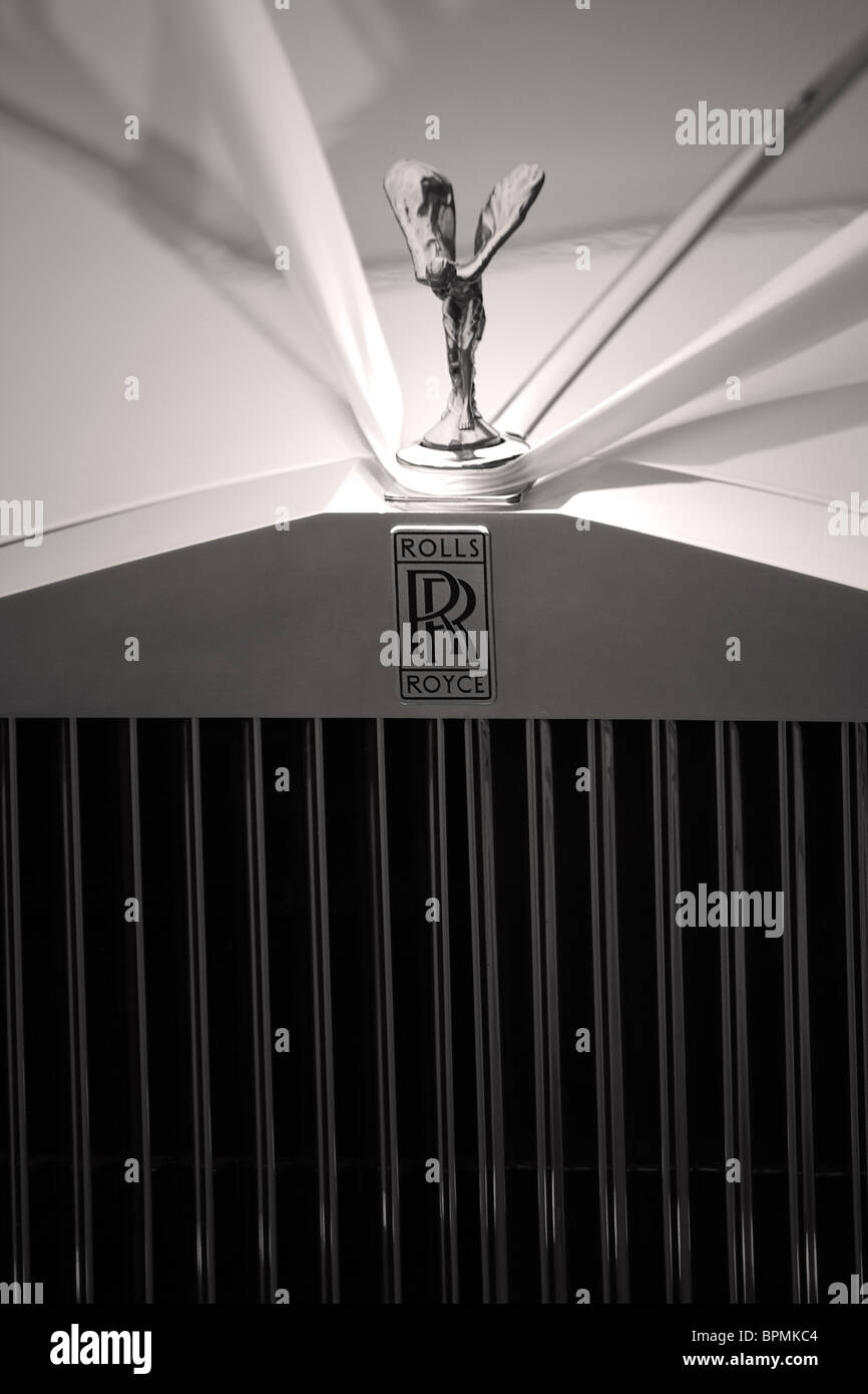 The front grill, logo and spirit of ecstasy mascot with wedding ribbons ...