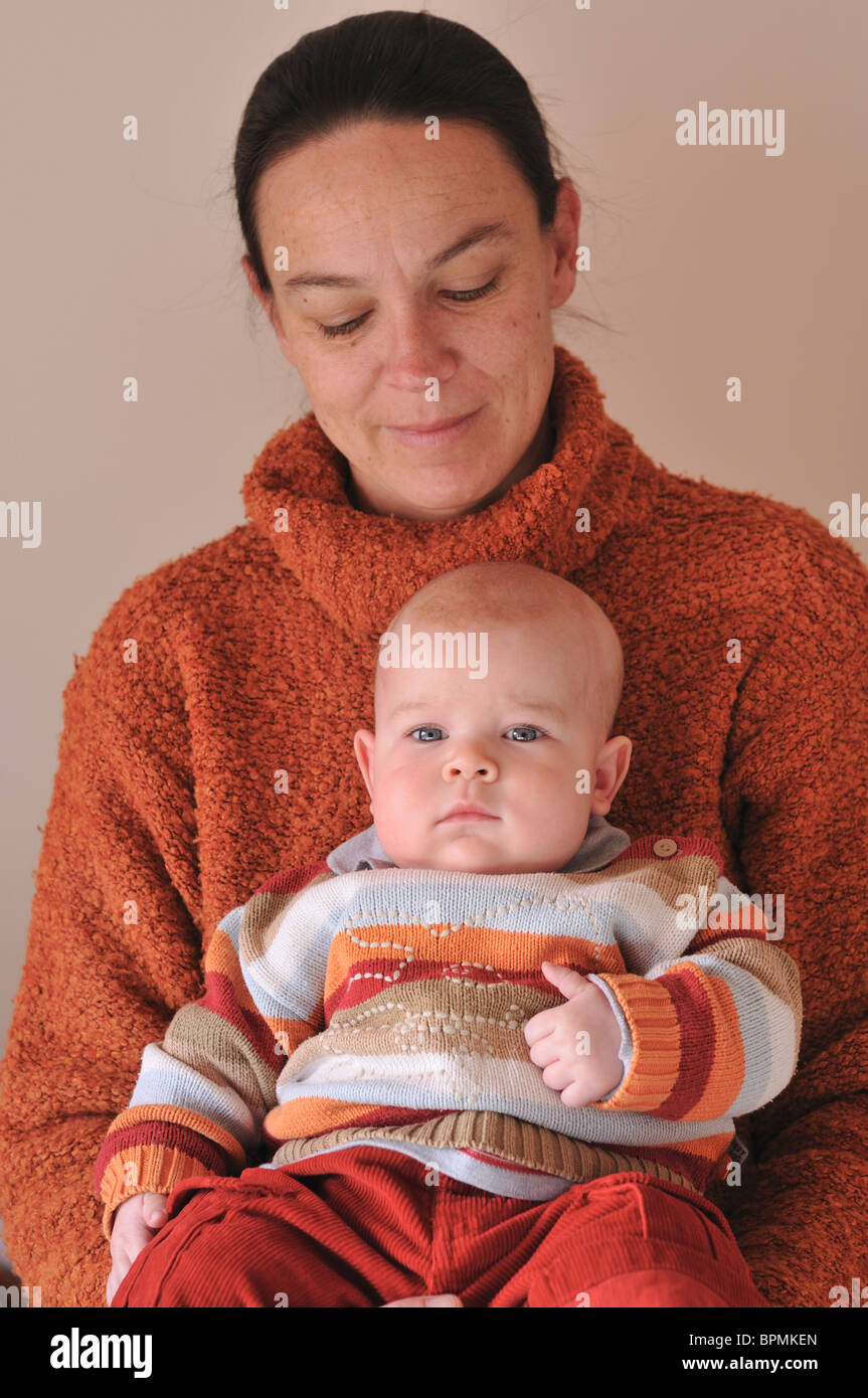 Mother holding her three and half months old baby Stock Photo - Alamy