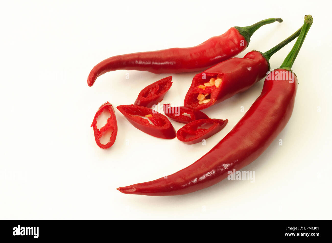 Red Pepper (Capsicum annuum), ripe pods, studio picture against a white ...
