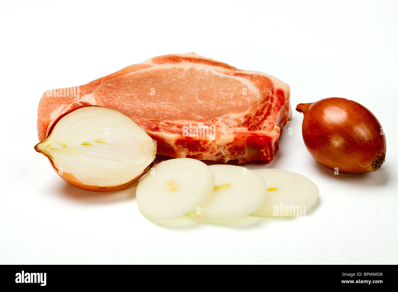 Pork stake and the cut onions isolated on a white background Stock ...