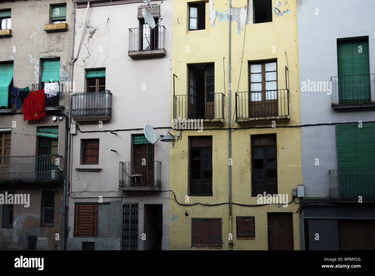 A block of poor houses and flats street scene from Olot in the La ...