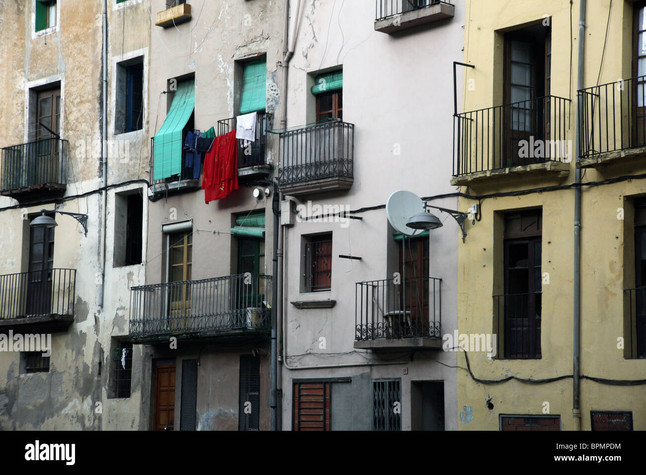 A block of poor houses and flats street scene from Olot in the La ...