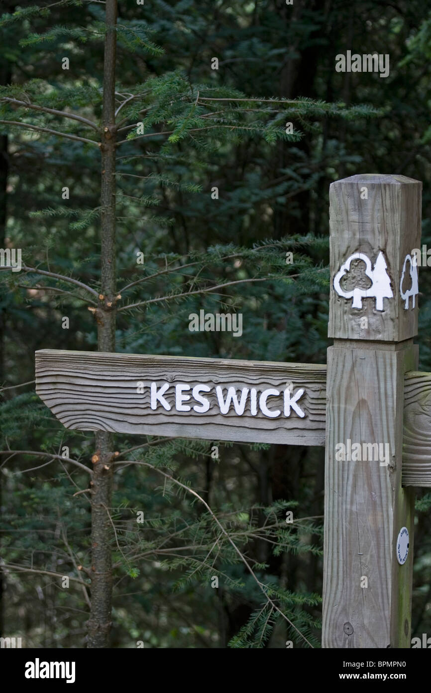 Wooden finger post sign pointing to Keswick, Lake District, England. In ...