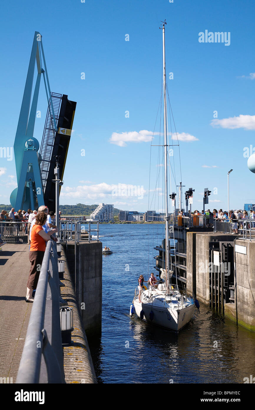 Yachts entering lock gates at Cardiff bay barrage from penarth marina ...