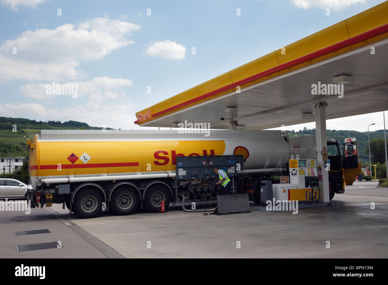 Luxembourg, Europe. Shell oil tanker delivering petrol to a filling ...
