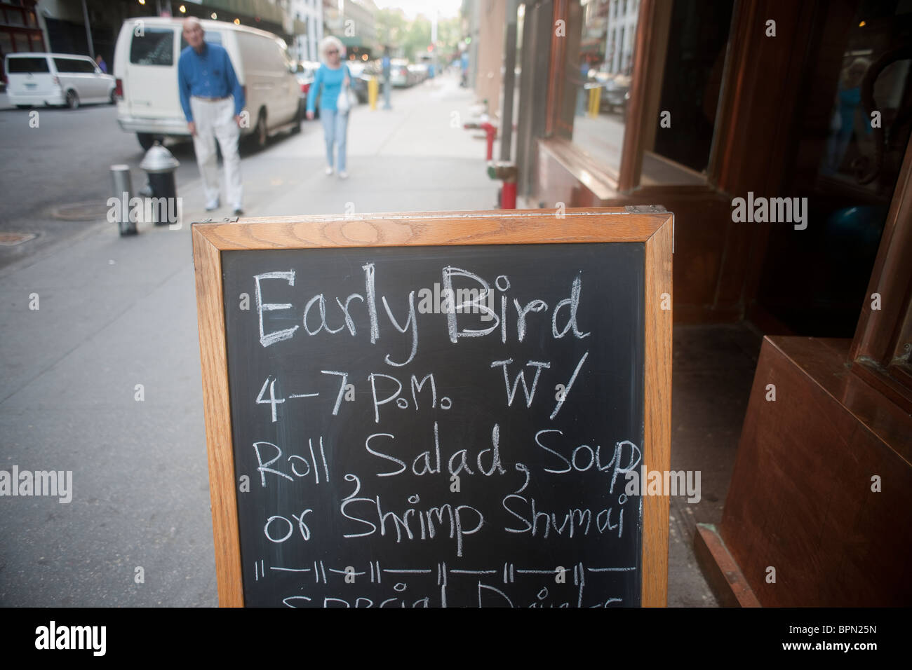 The early bird special is advertised outside a restaurant in New York ...
