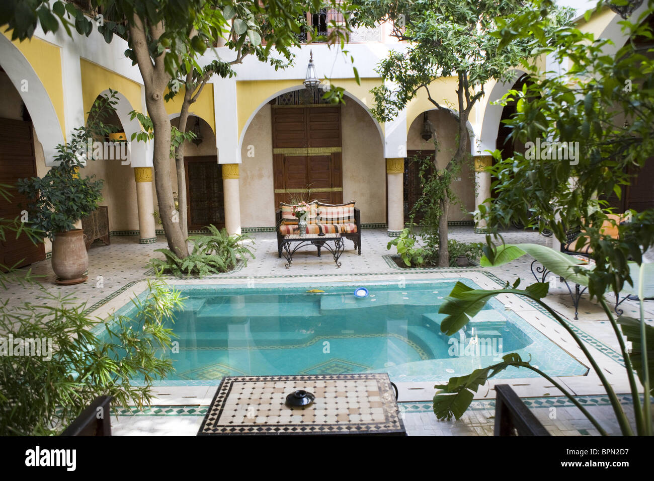 Patio with a pool of a Riad in Marrakech, Morocco Stock Photo - Alamy