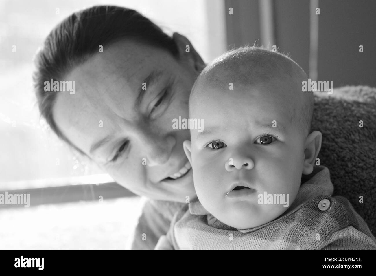 Three and half months old baby and mother headshot Stock Photo - Alamy