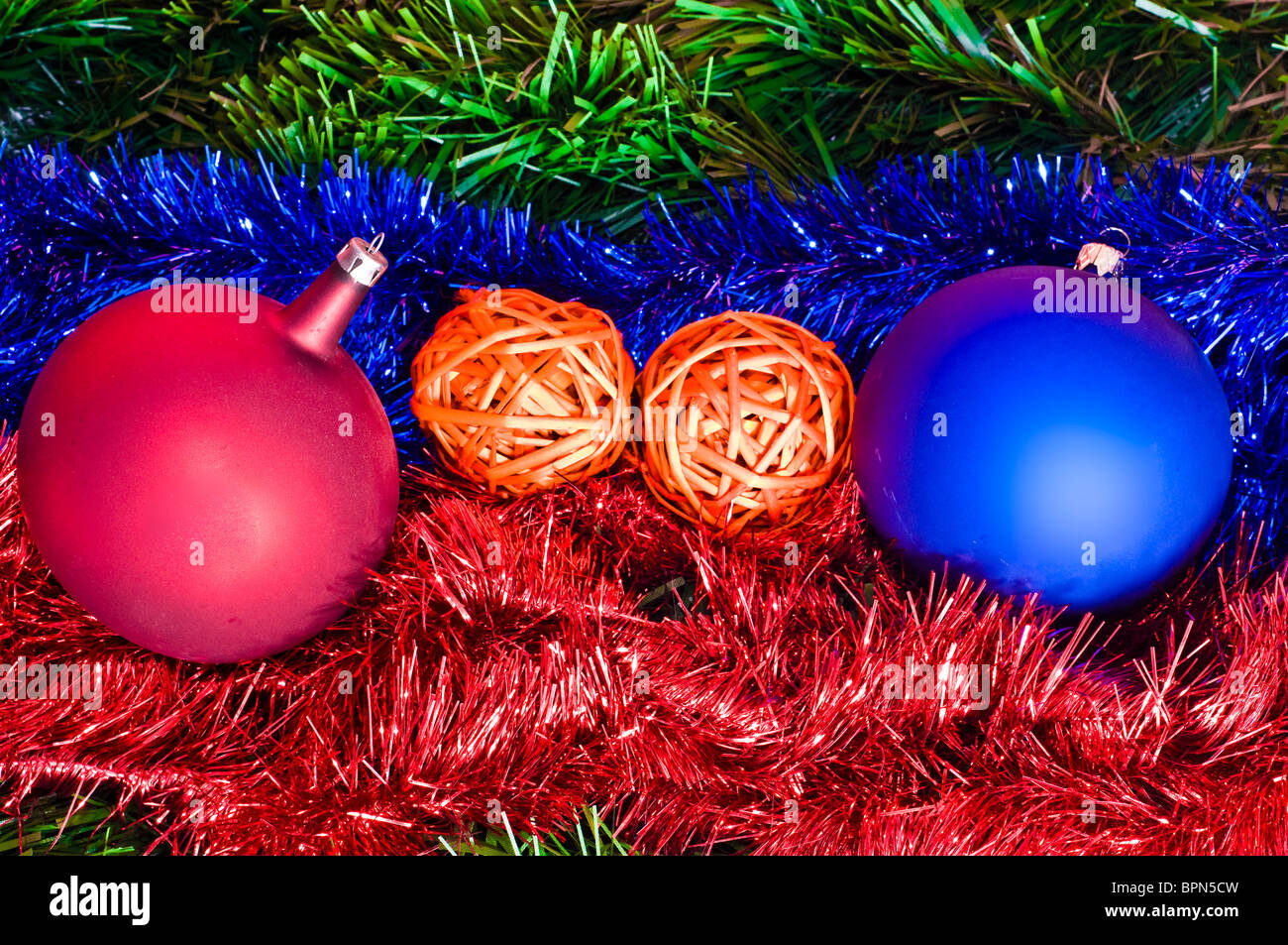 Bomblets and xmas decorations on red and blue chains Stock Photo - Alamy