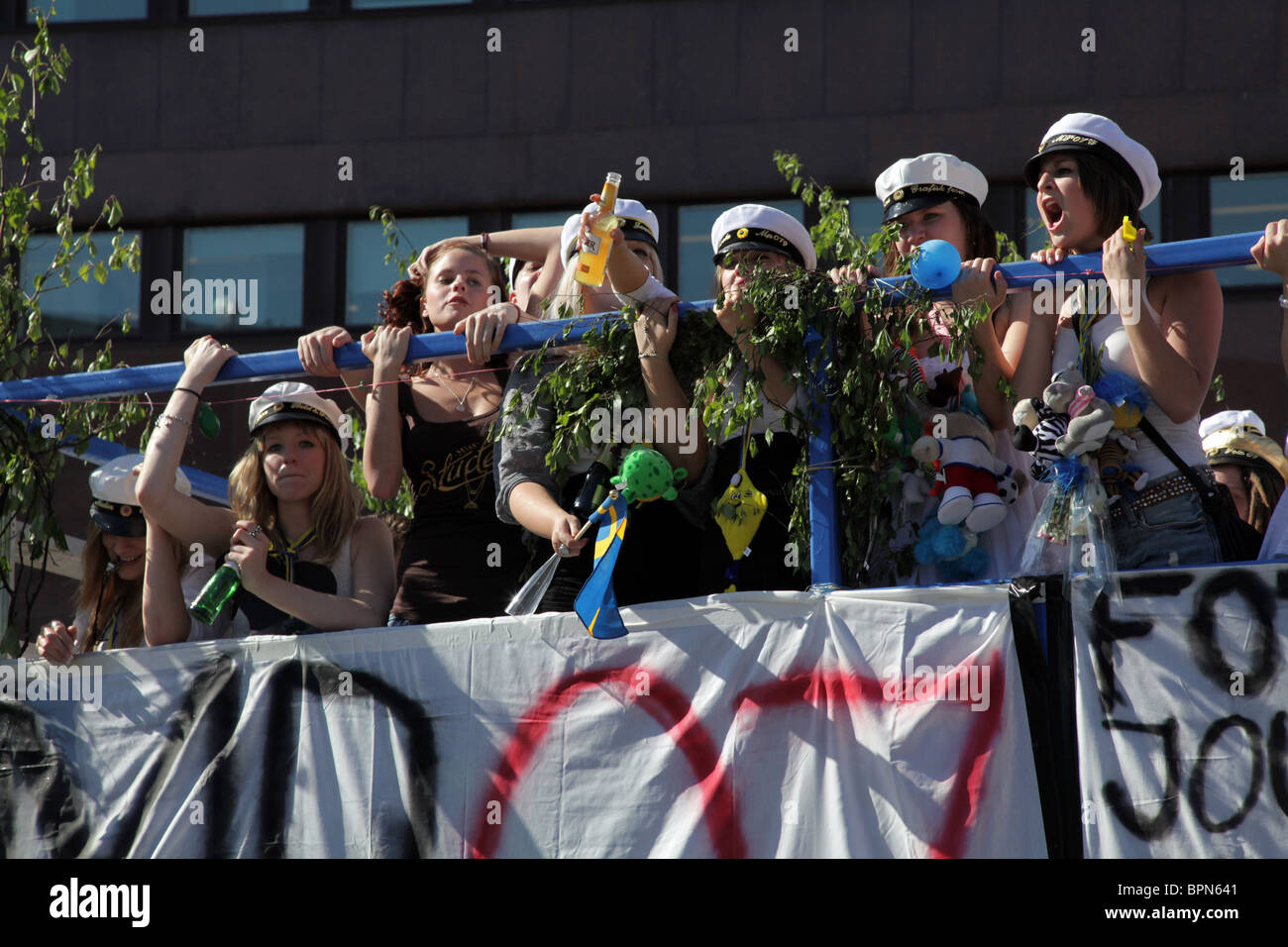 Swedish college students celebrate Graduation Day on a open top bus in ...