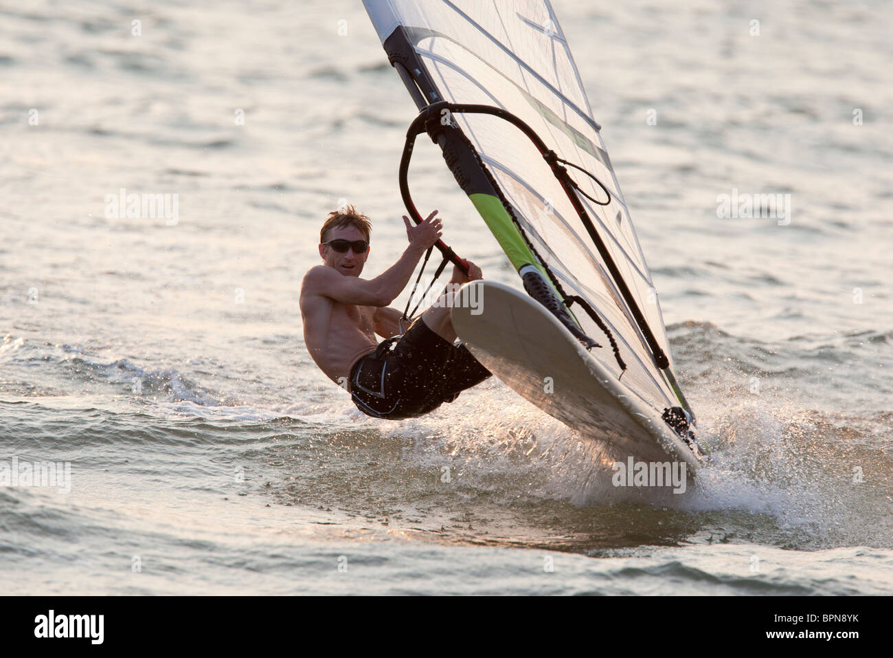 A jumping windsurfer Stock Photo - Alamy