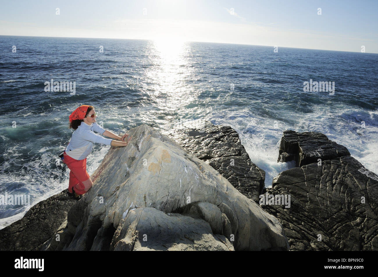 Woman climbing over wall hi-res stock photography and images - Alamy