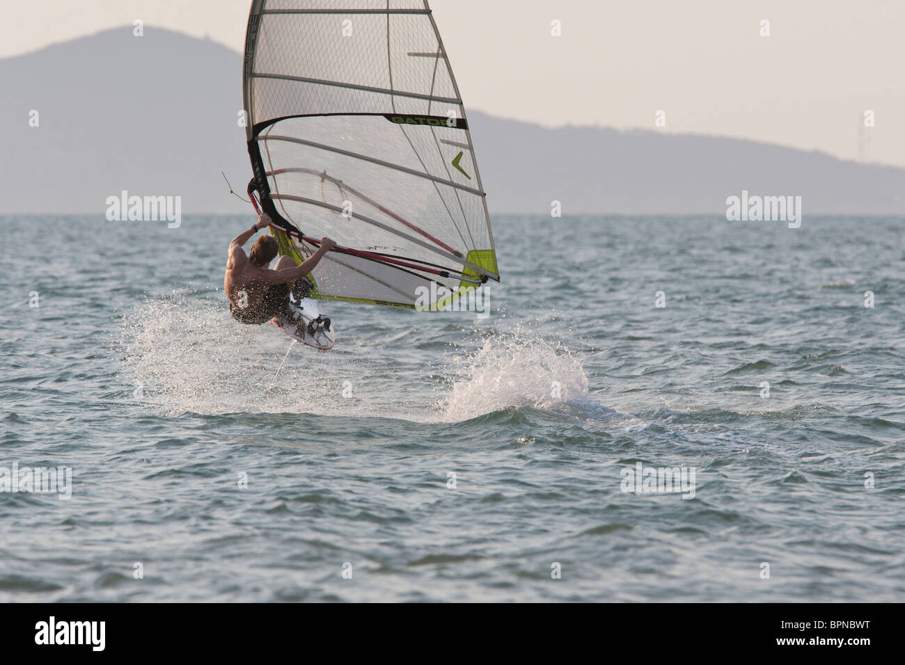 A jumping windsurfer Stock Photo - Alamy