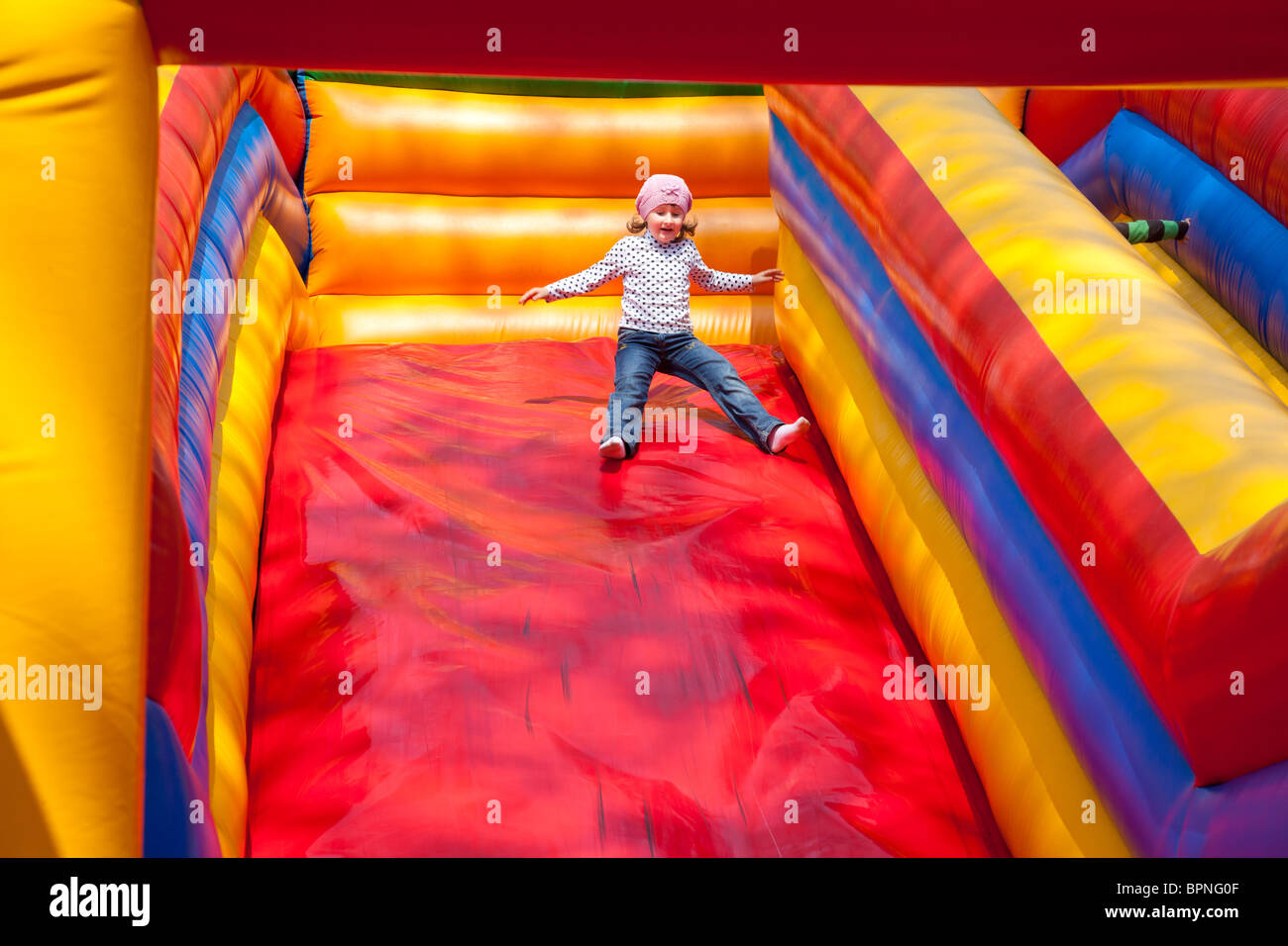 Little Girl Having Fun On A Blown Up Slider Stock Photo Alamy little-girl-having-fun-on-a-blown-up-slider-stock-photo-alamy
