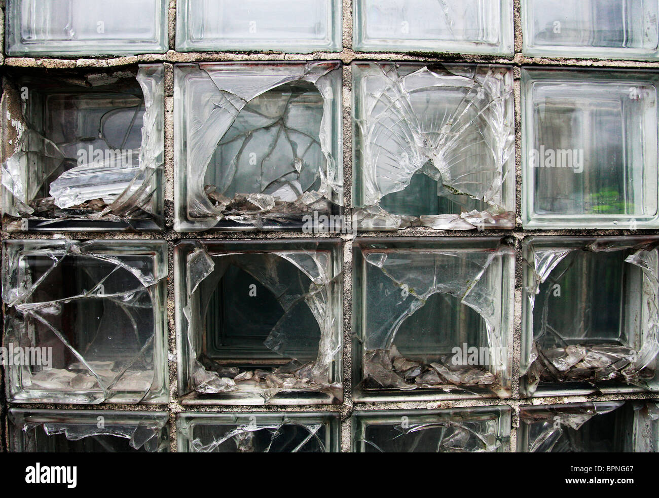 Broken glass in an industrial strength window frame Stock Photo - Alamy