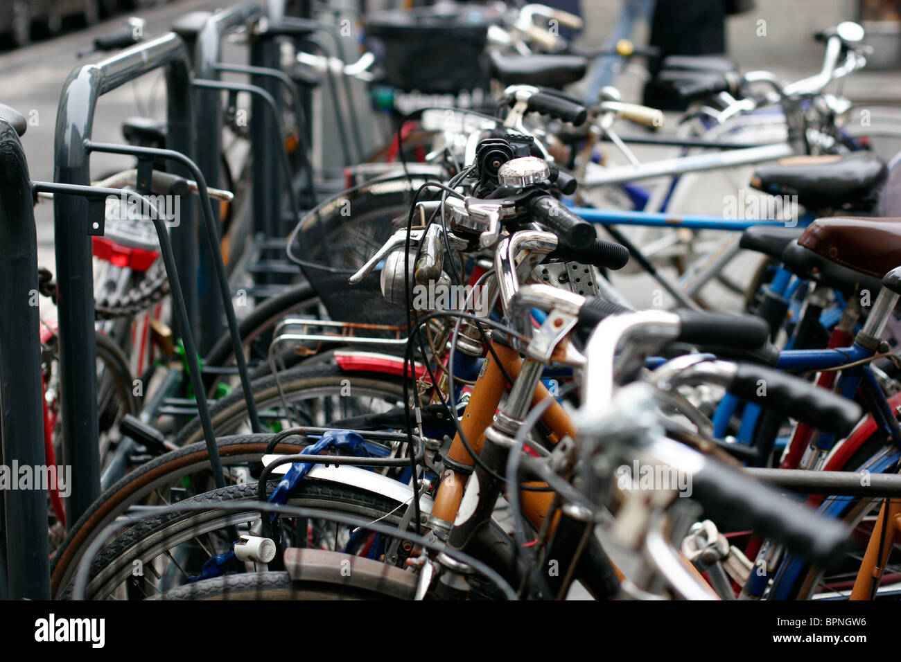 city bike park rack with blur background Stock Photo - Alamy