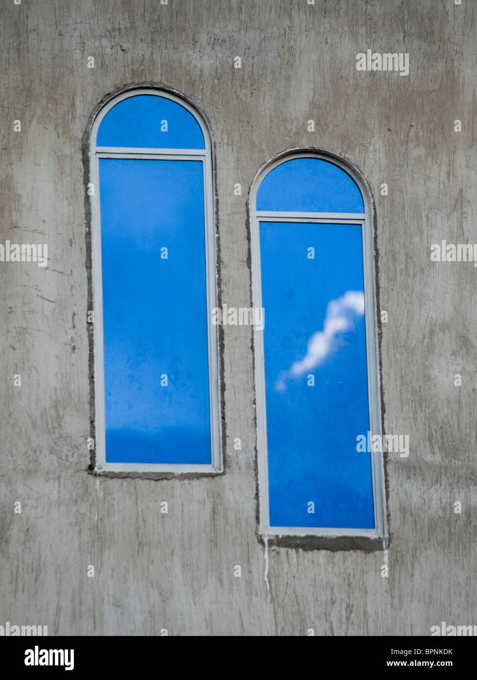 Santiago Atitlan, Guatemala Clouds reflected in mirrored windows Stock ...