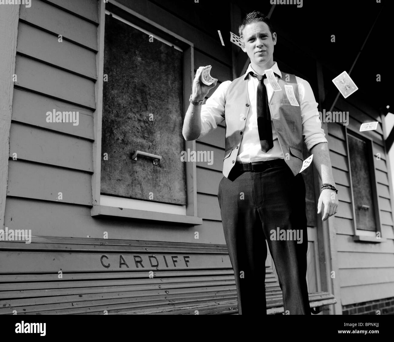 young white male magician performing card tricks outside Stock Photo ... young white male magician performing card tricks outside Stock Photo ...