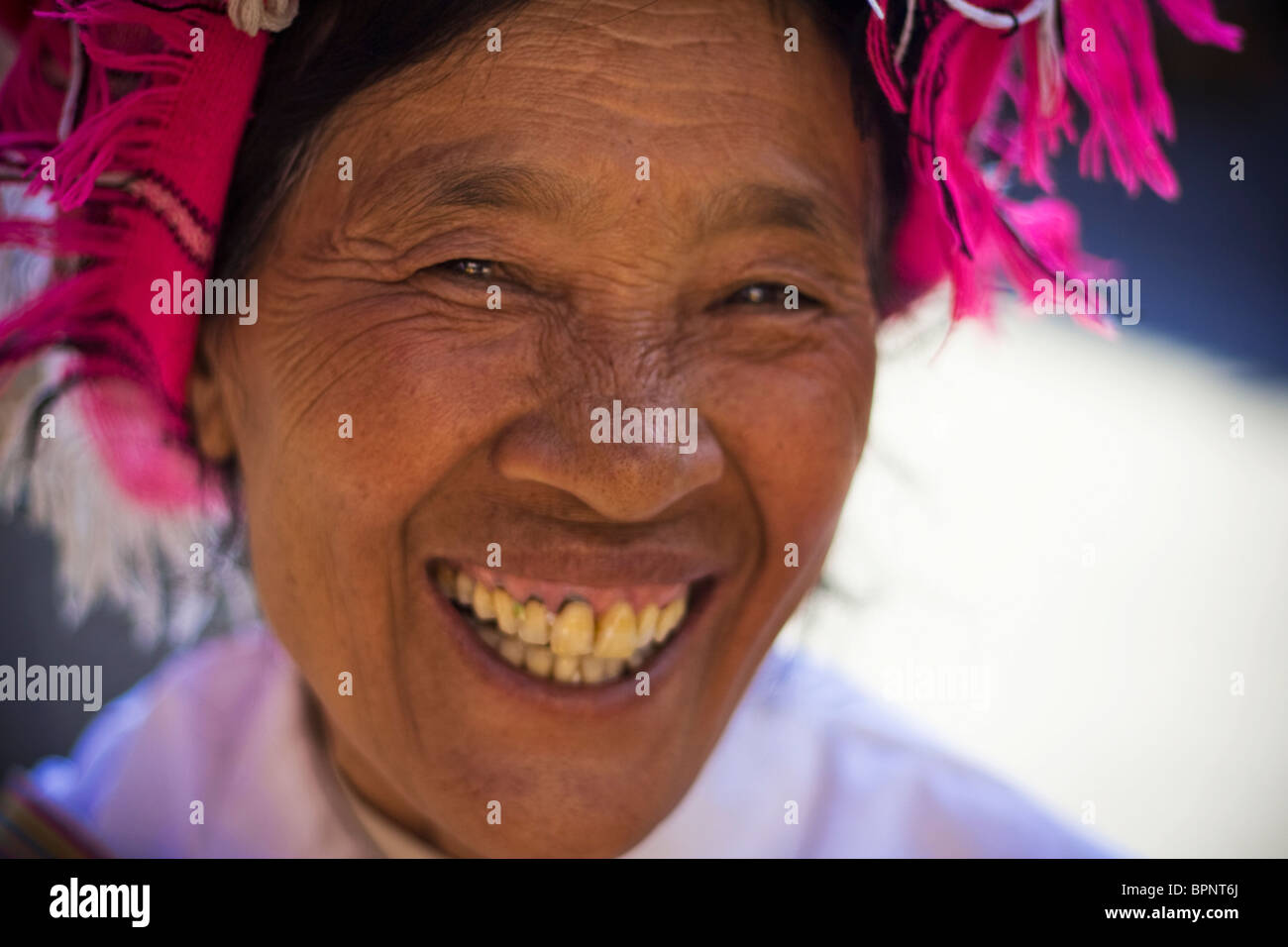 A Chinese lady in a pink headdress in Dali, Yunnan provence, China ...