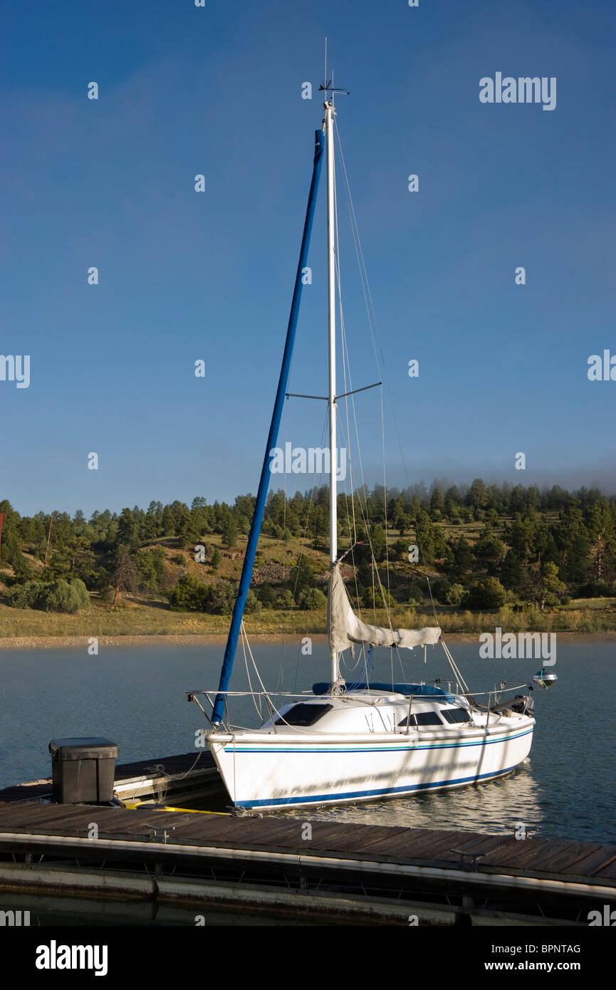 A sailboat docked at a lake marina Stock Photo - Alamy