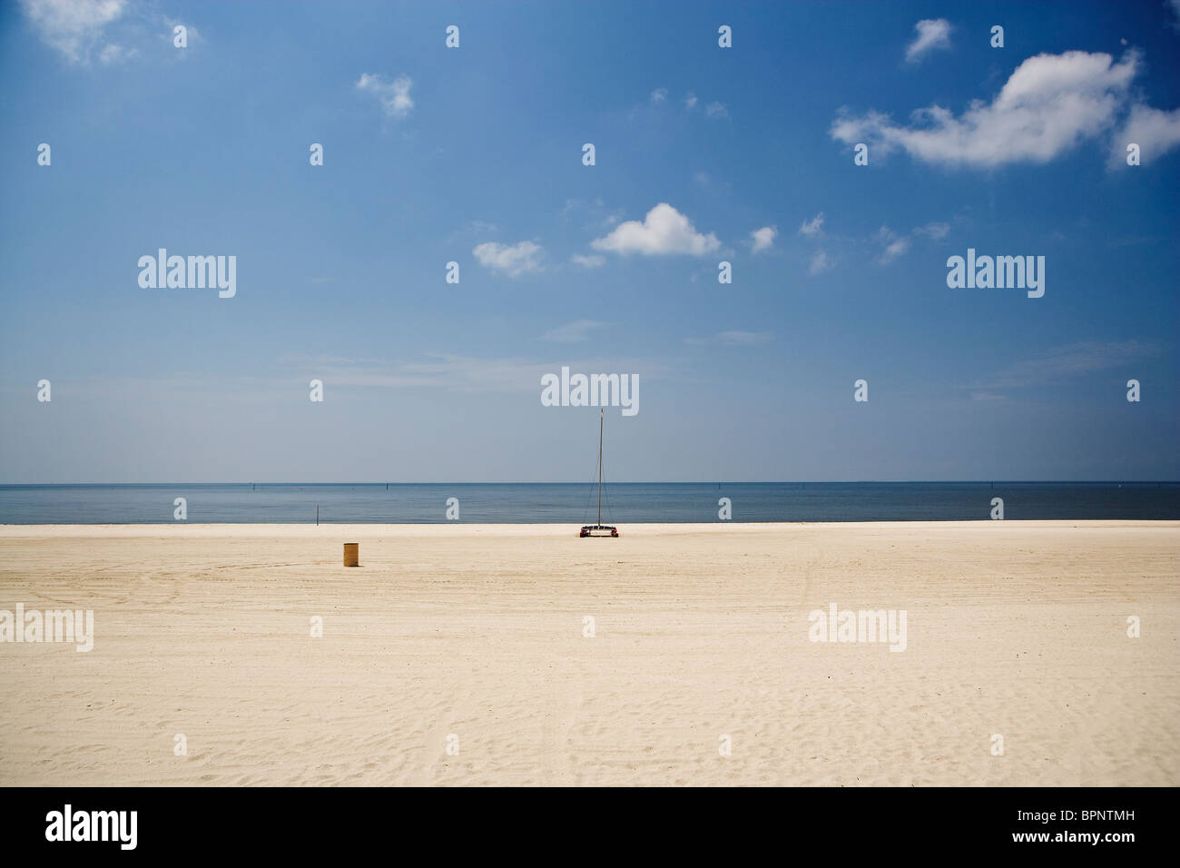 A clean and empty beach along the Gulf Coast in July with only a small ...