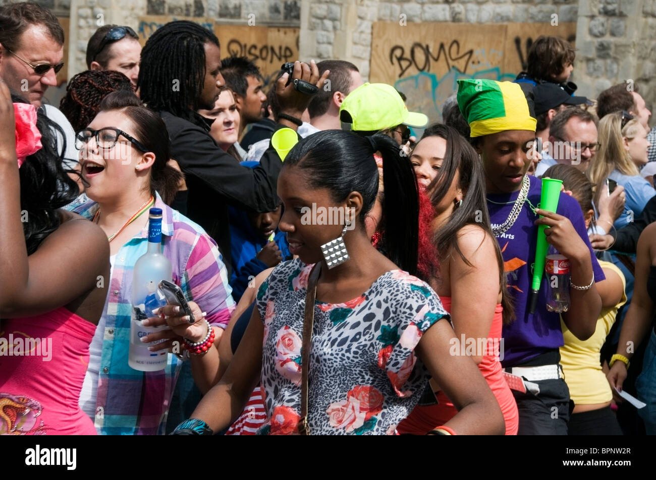 Multicultural group of people, men and women spectators at Notting Hill ...