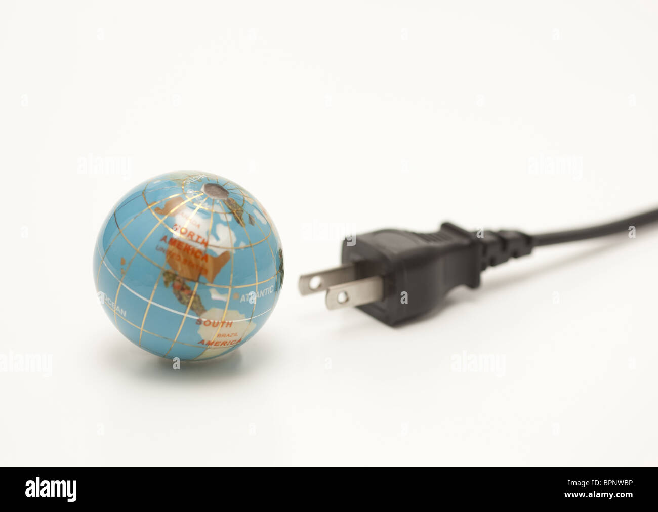 Globe and plug Stock Photo - Alamy