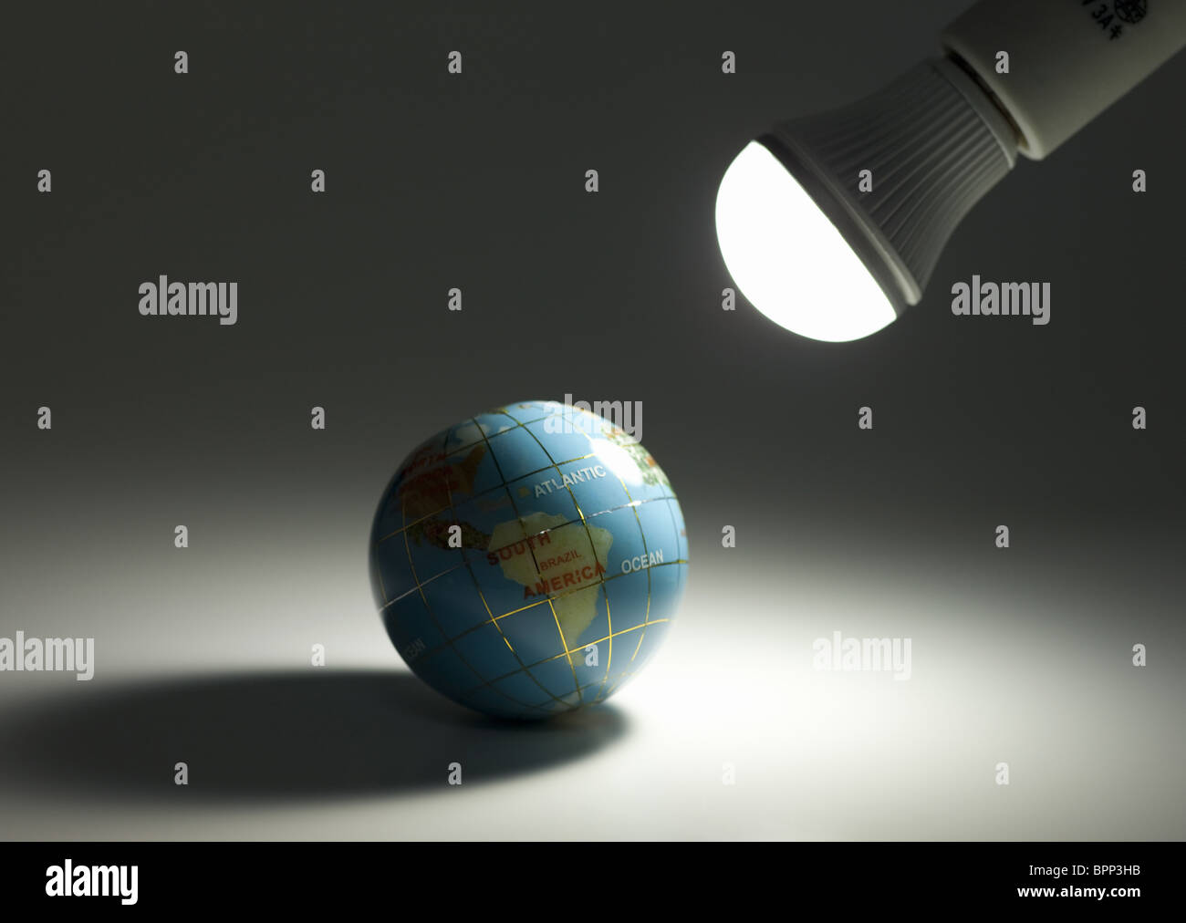 LED bulb and globe Stock Photo - Alamy