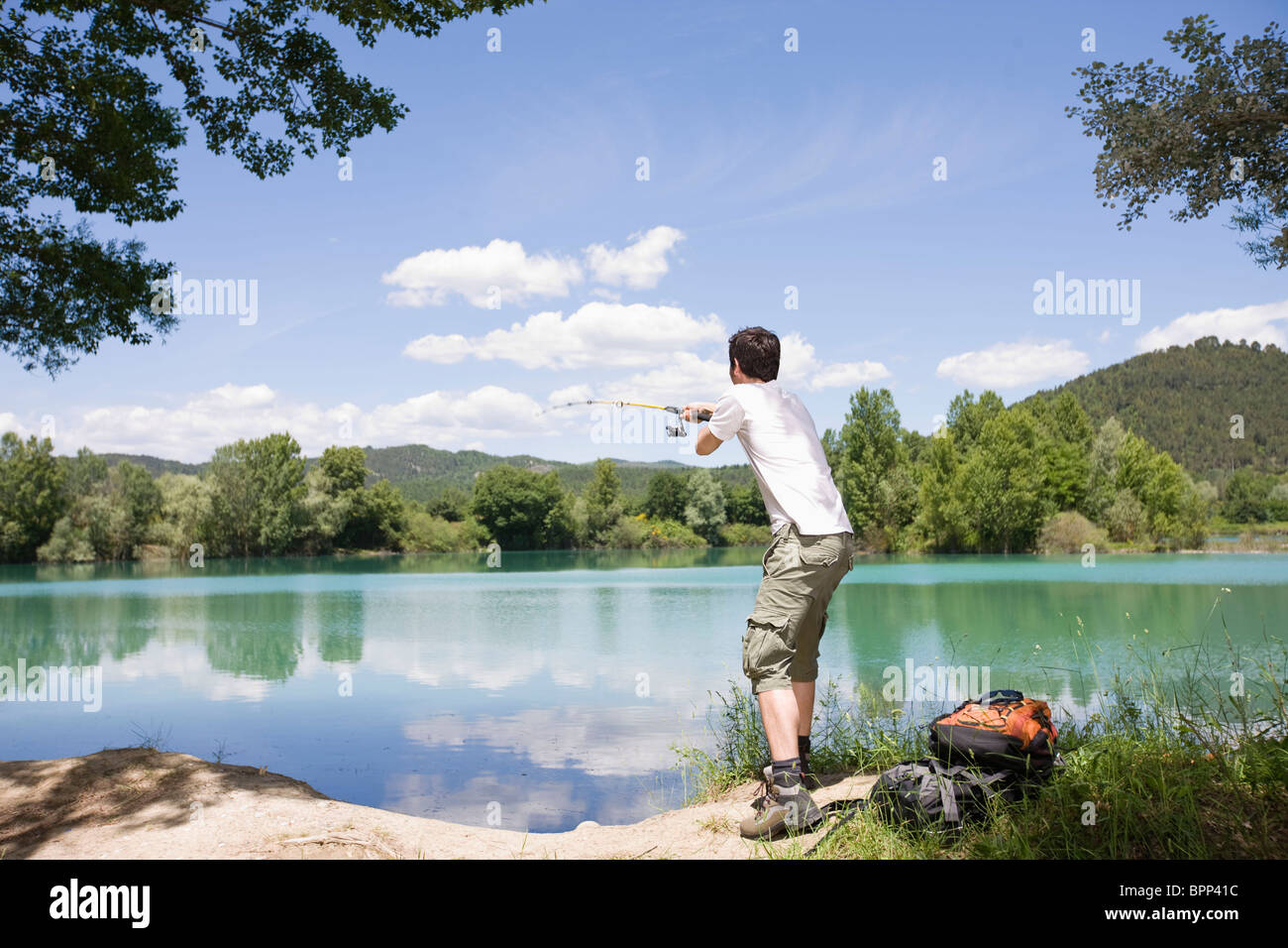 Man trying to catch a fisch Stock Photo - Alamy