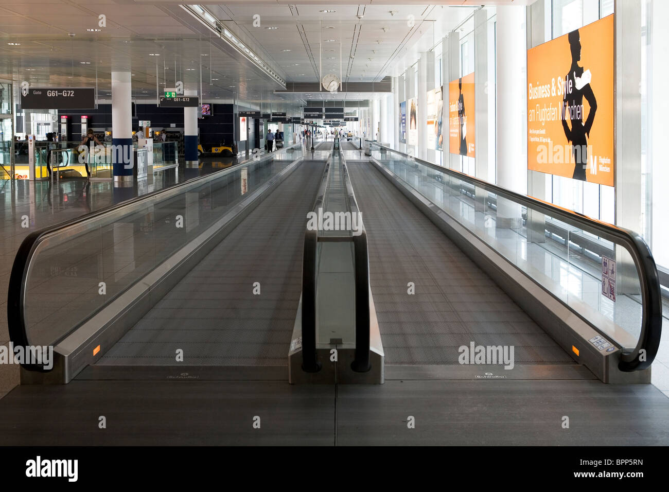A walkway in an airport Stock Photo - Alamy