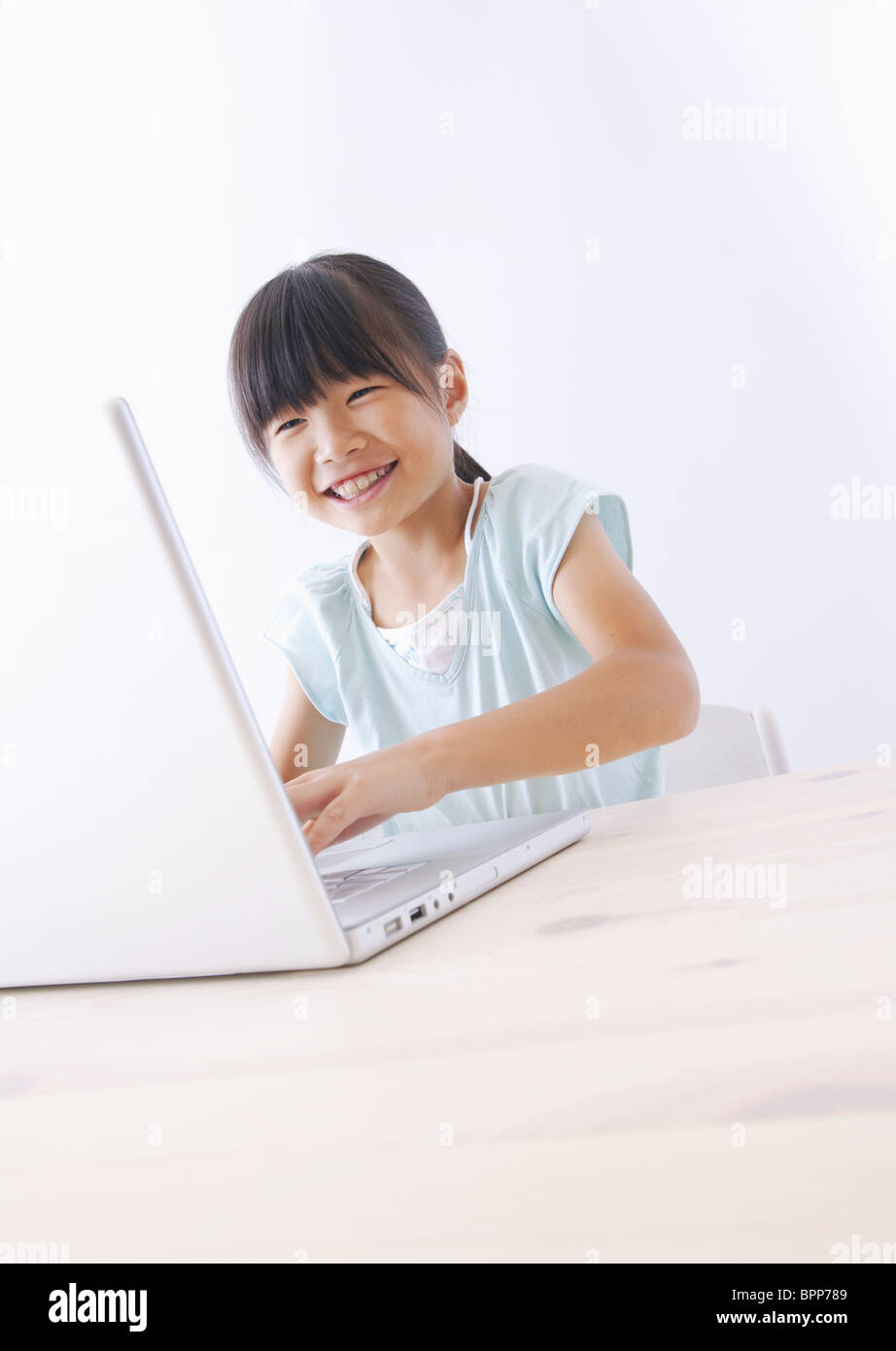 Girl studying with a laptop computer Stock Photo - Alamy