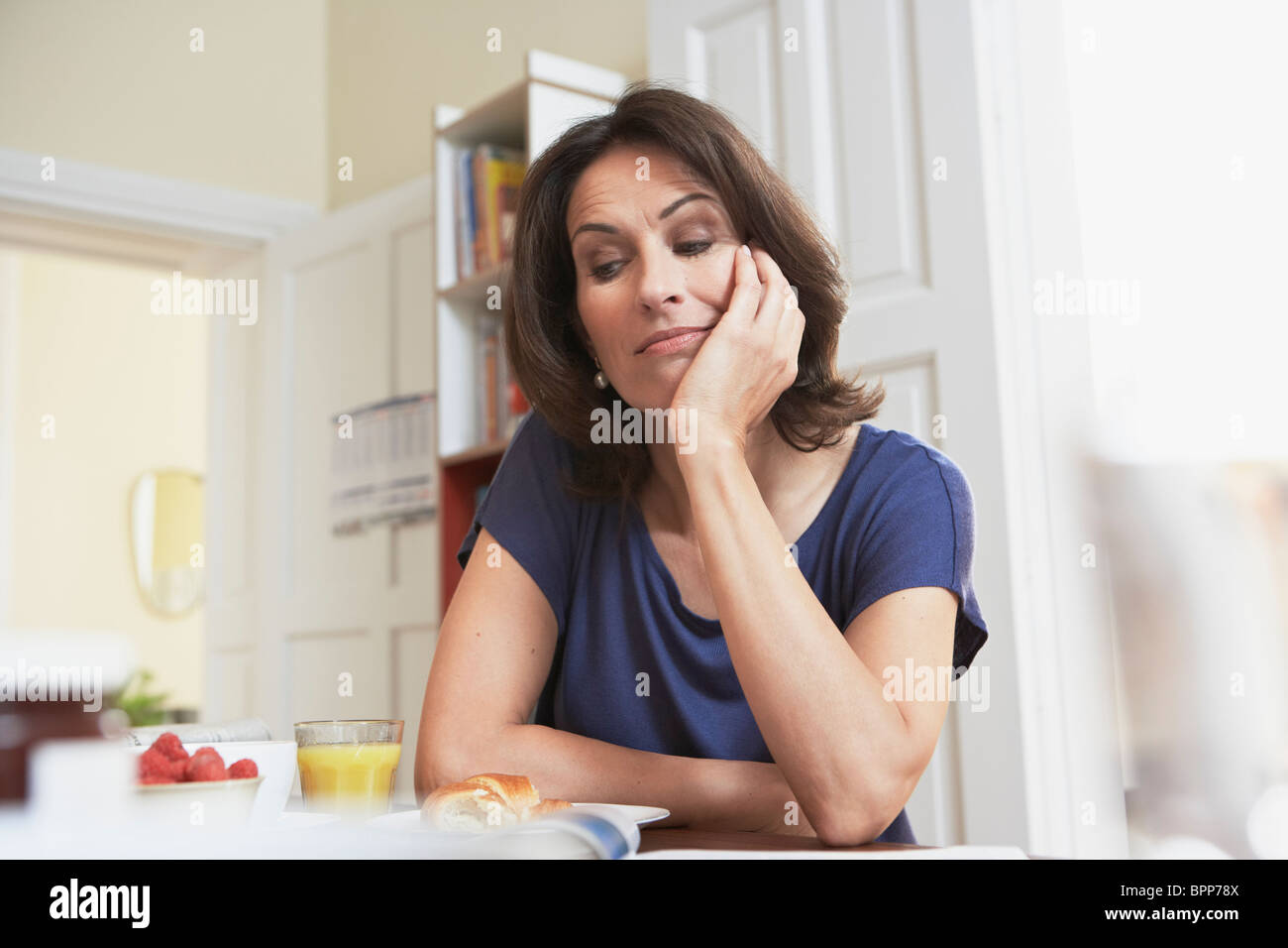 Woman looking bored Stock Photo - Alamy