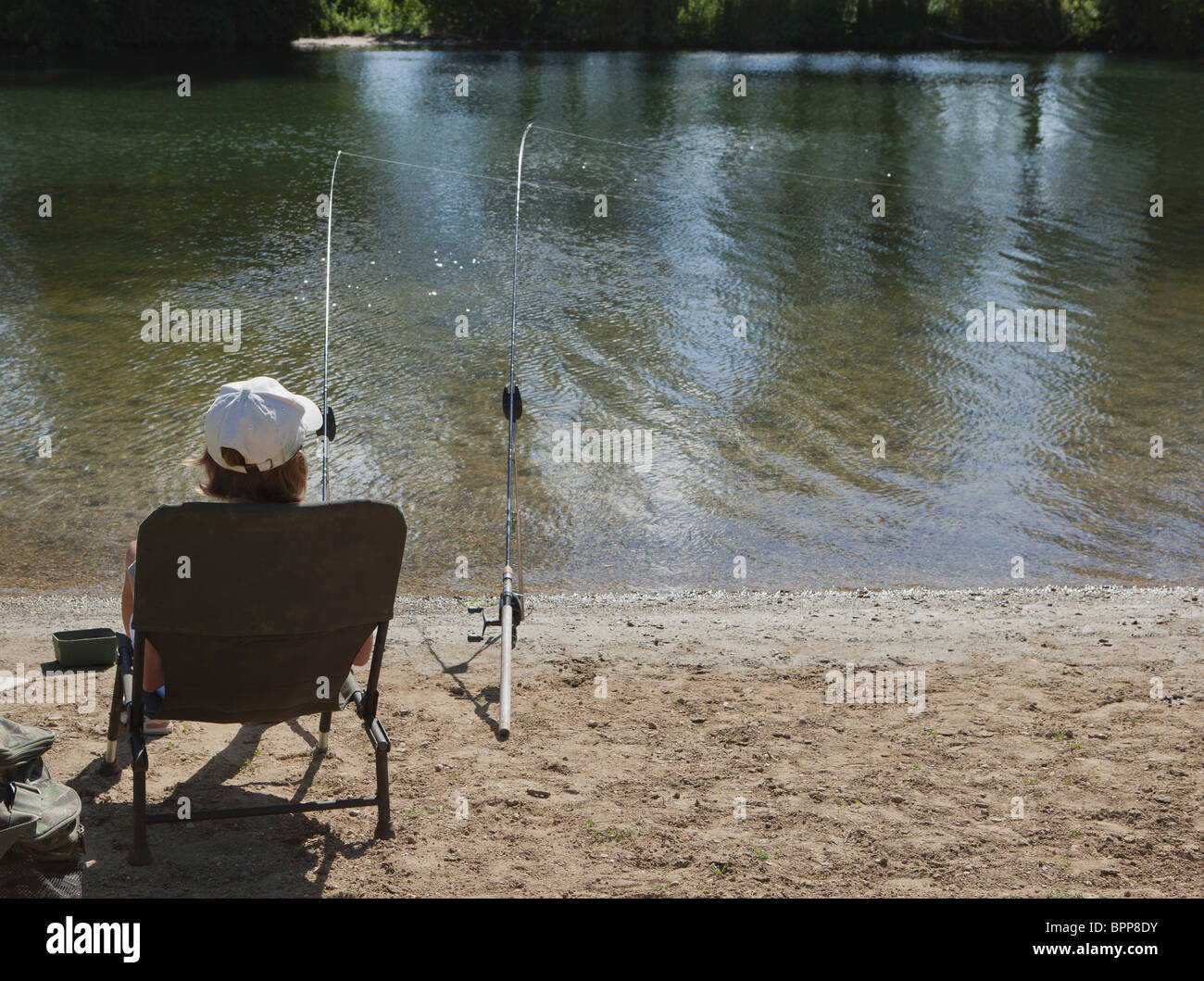Woman fishing on rod from hi-res stock photography and images - Alamy