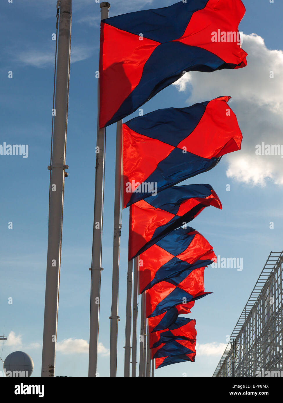 View looking up at colourful flags flying in the wind Stock Photo - Alamy