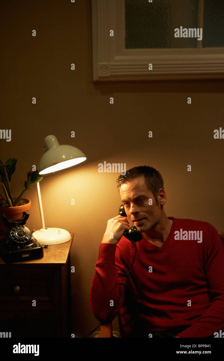Man phoning with vintage phone Stock Photo - Alamy