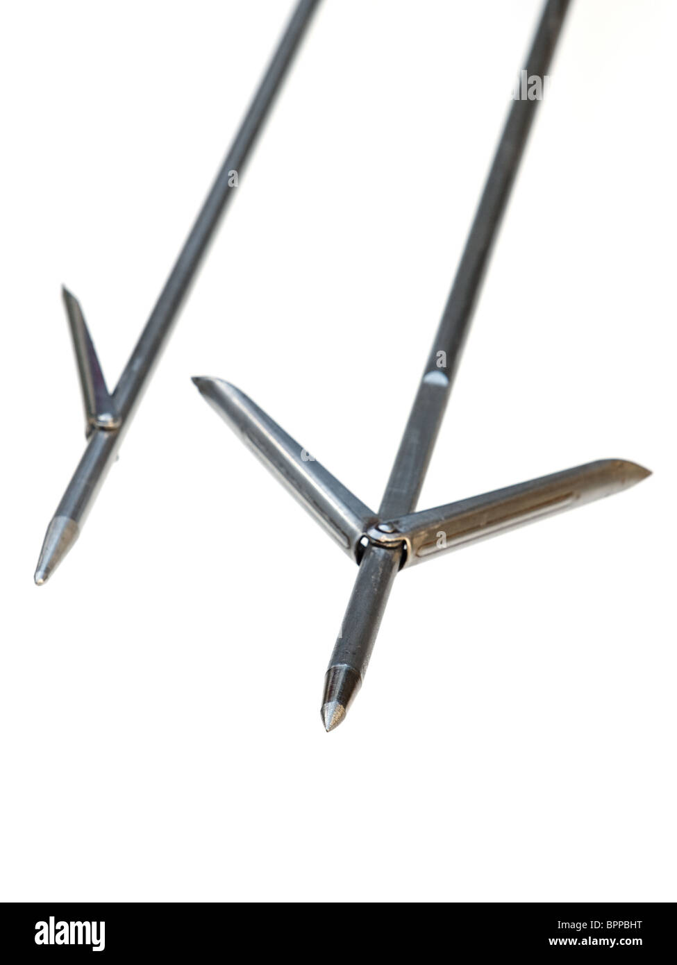 Steel fishing harpoons are isolated on a white background Stock Photo ...