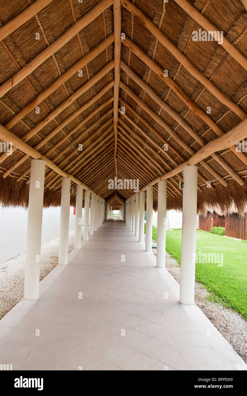A long walkway under a straw and bamboo thatched roof Stock Photo - Alamy