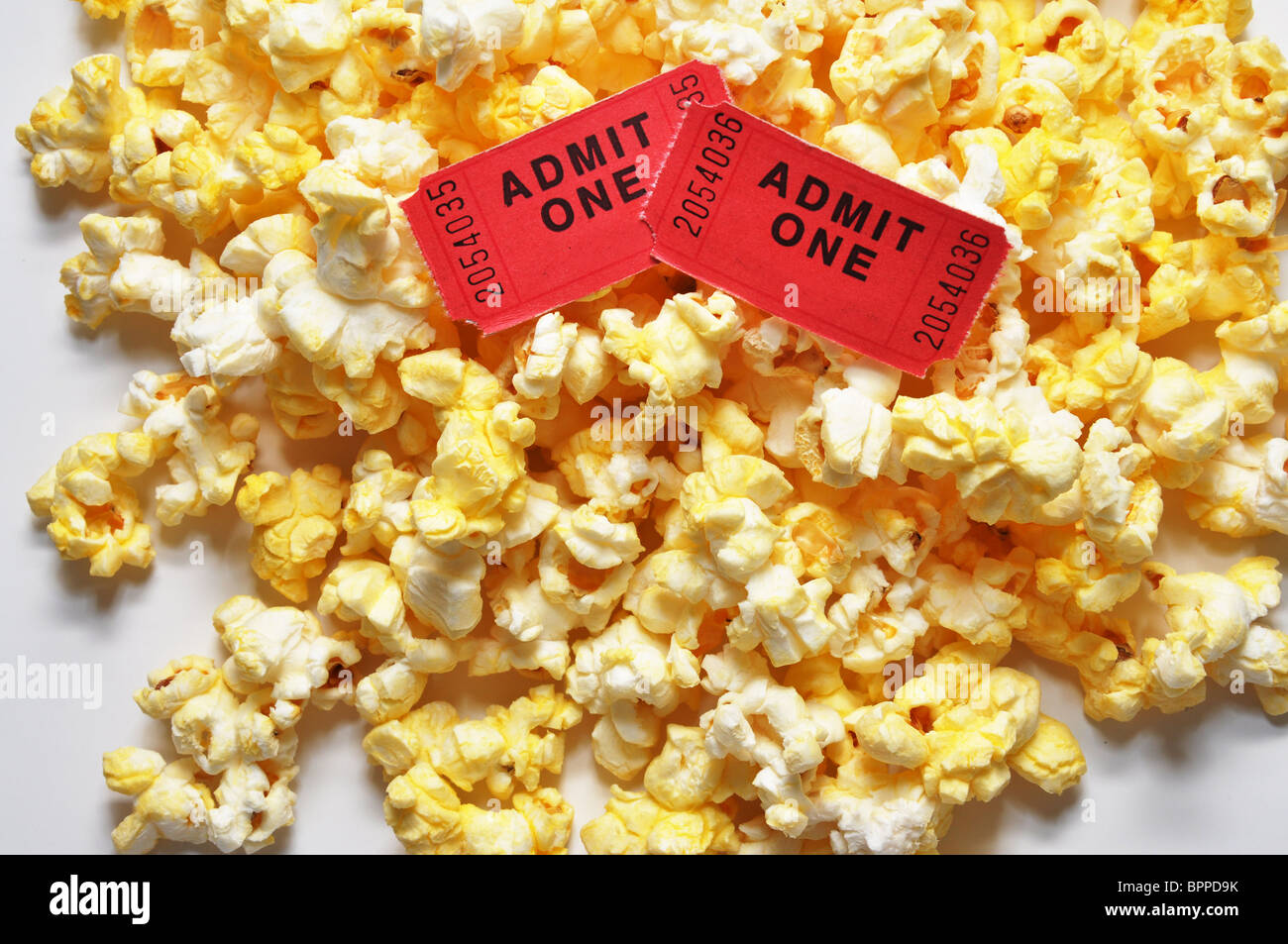 Two movie tickets and popcorn Stock Photo - Alamy
