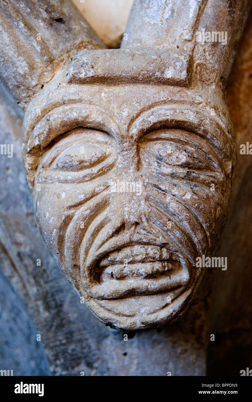 Pre Reformation medieval carved stone corbel of a grimacing face at St ...