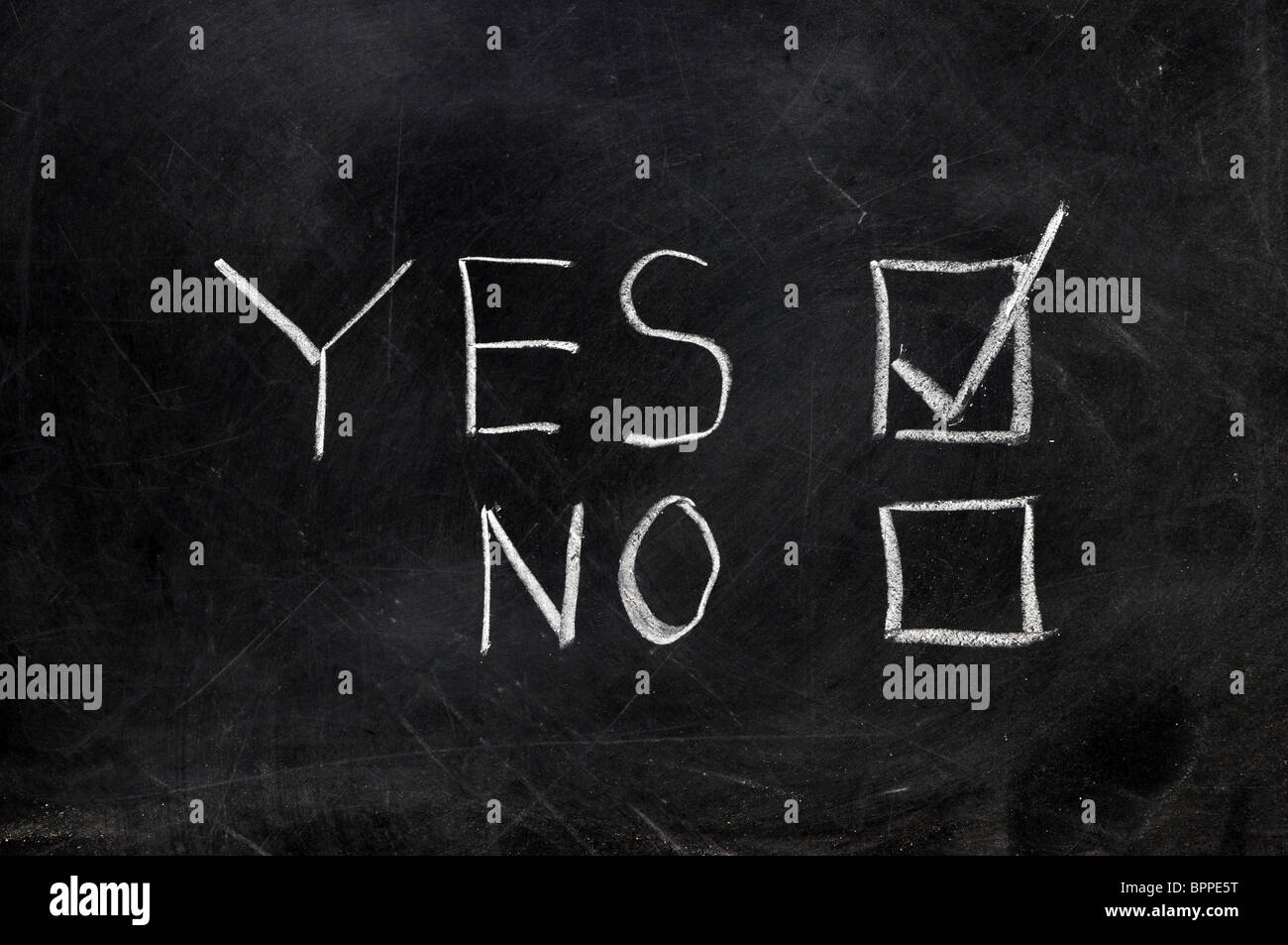 Check yes or no on black chalkboard with copy space Stock Photo - Alamy
