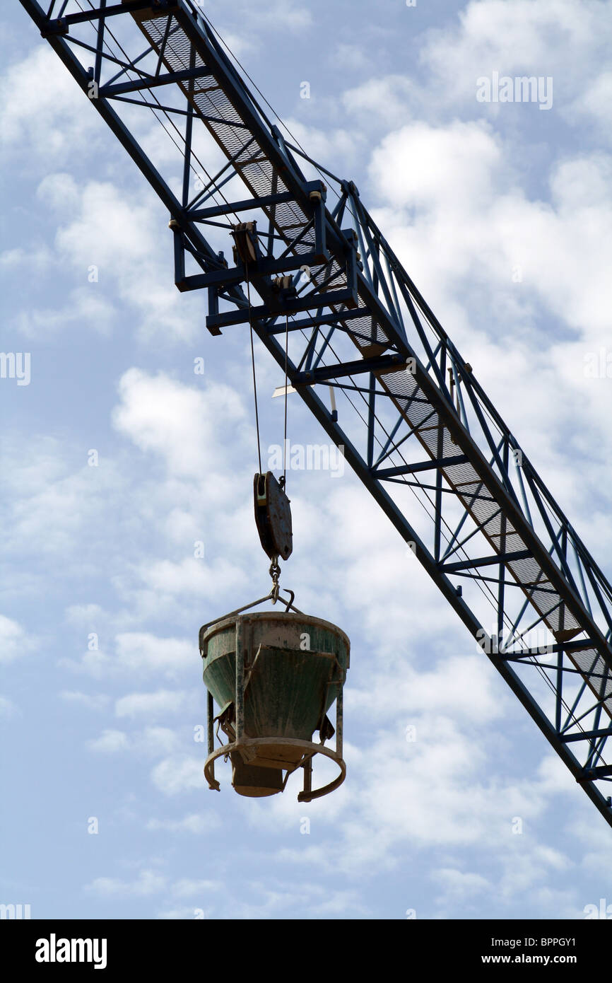 Blue derrick for the construction of housings Stock Photo - Alamy