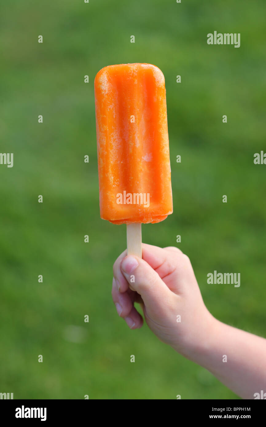 Child's hand holding popscile Stock Photo - Alamy